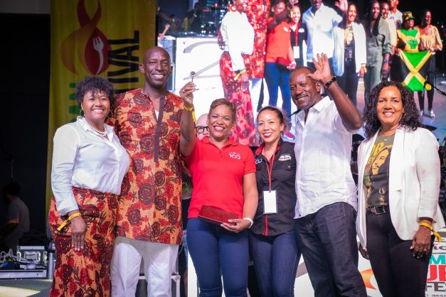 Andrea Coy, CEO of Grace Foods International Presented with the Key to ...